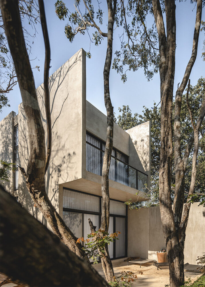 concrete residence with integrated yoga studio weaves around yucatan's ...