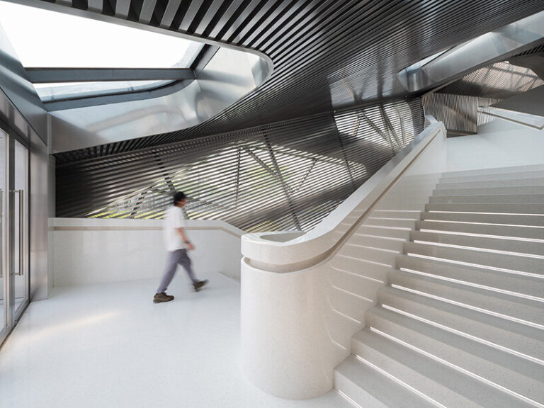 faceted glass curtain walls flood DJI's shenzhen origami-like flagship ...