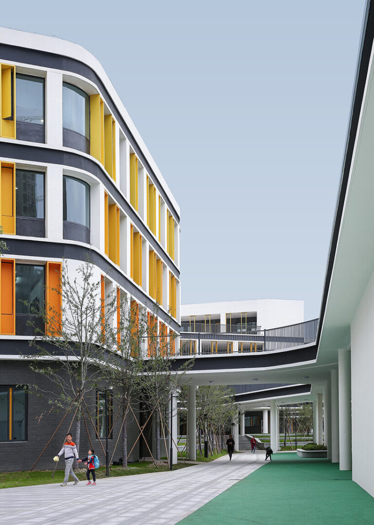 open, colorful facade by GLA design brings life to staggered school ...