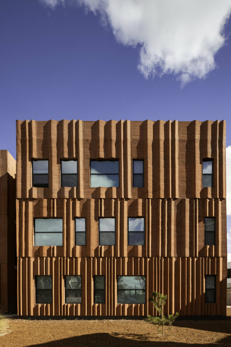 shadows shift throughout the day on RT2 apartments' undulating facade ...