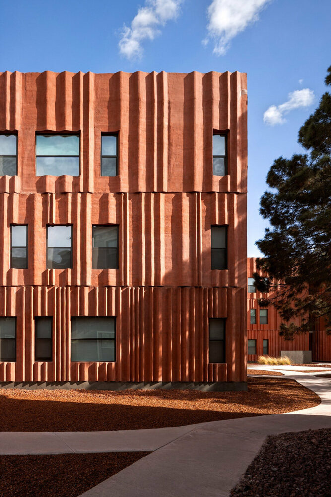 shadows shift throughout the day on RT2 apartments' undulating facade ...