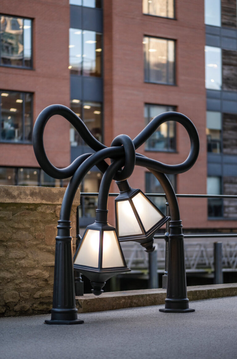 alex chinneck knots street lamps and twists a phone booth for his ...