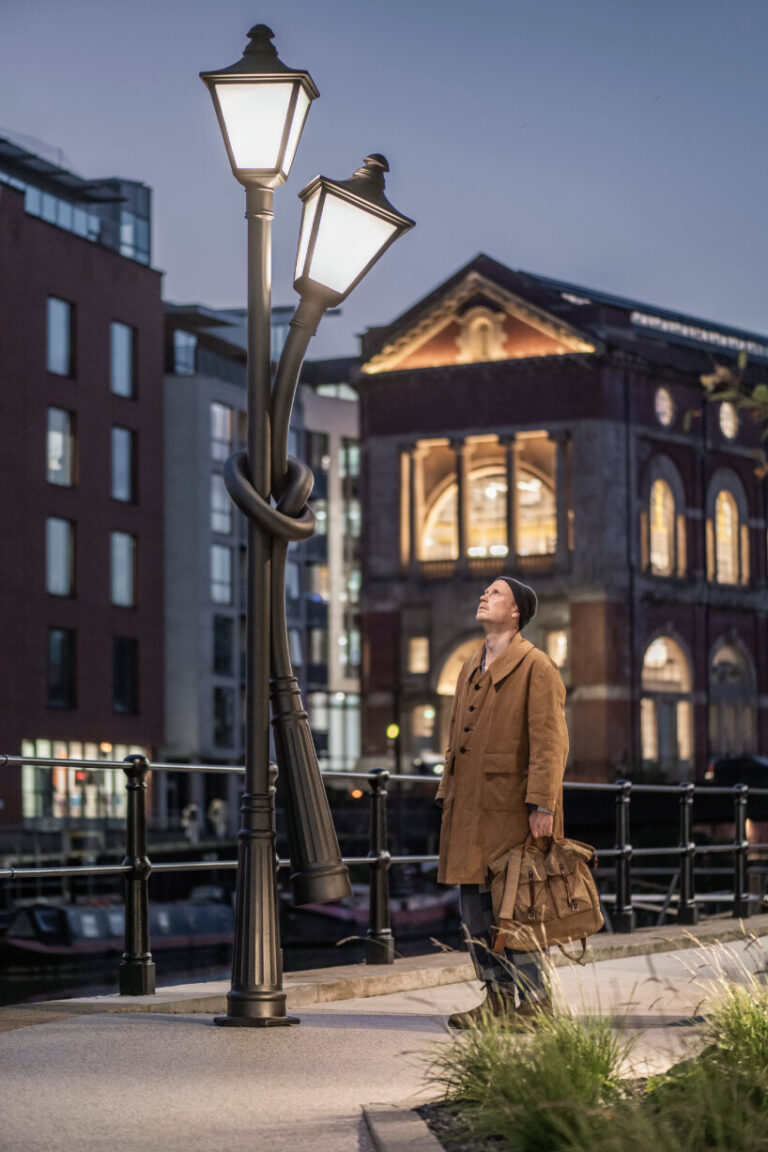 alex chinneck knots street lamps and twists a phone booth for his ...