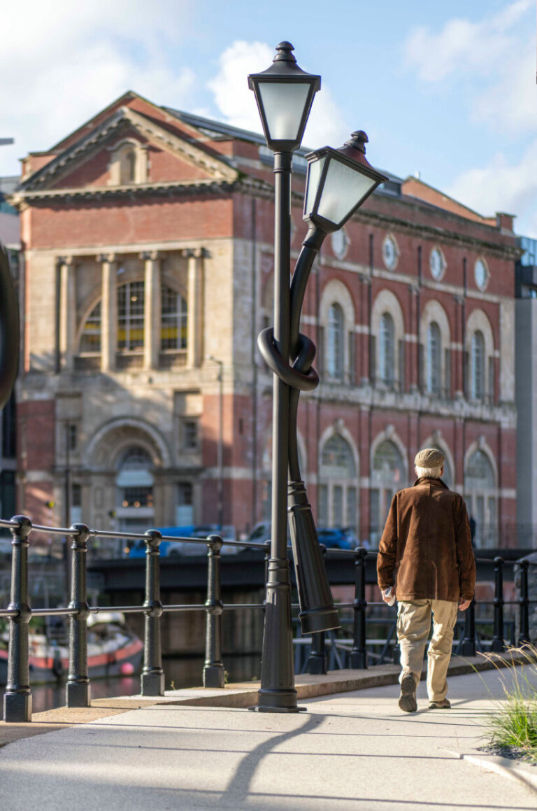 alex chinneck knots street lamps and twists a phone booth for his ...