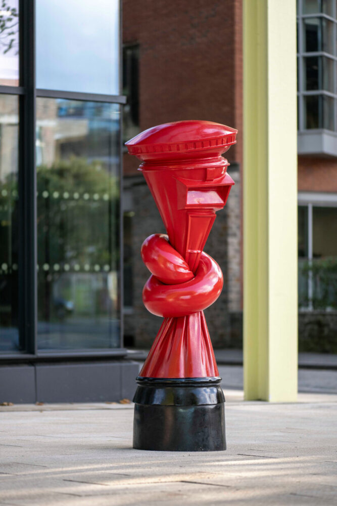 alex chinneck knots street lamps and twists a phone booth for his ...