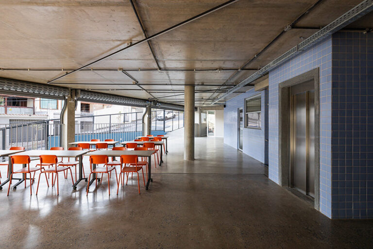 aluminum second skin facade shields alumnus school from brazilian sunlight