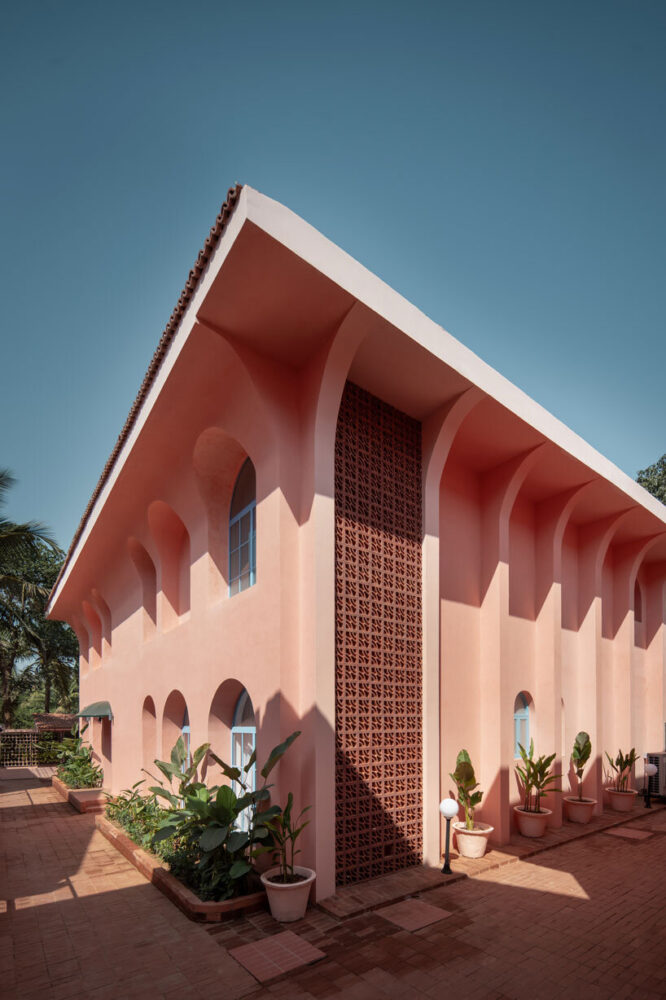 six u-shaped villas in north goa shape up bold pink arches around pool ...