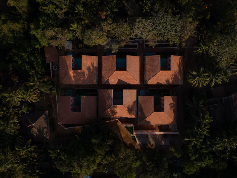 six u-shaped villas in north goa shape up bold pink arches around pool ...