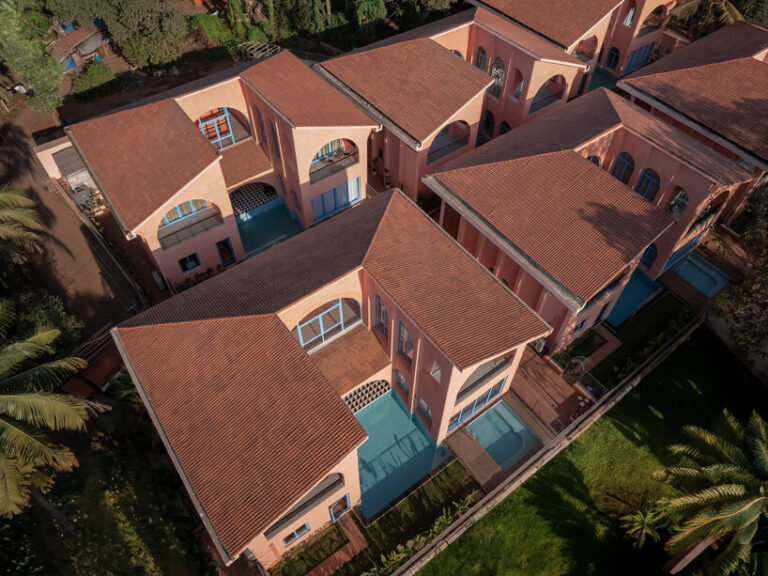 six u-shaped villas in north goa shape up bold pink arches around pool ...