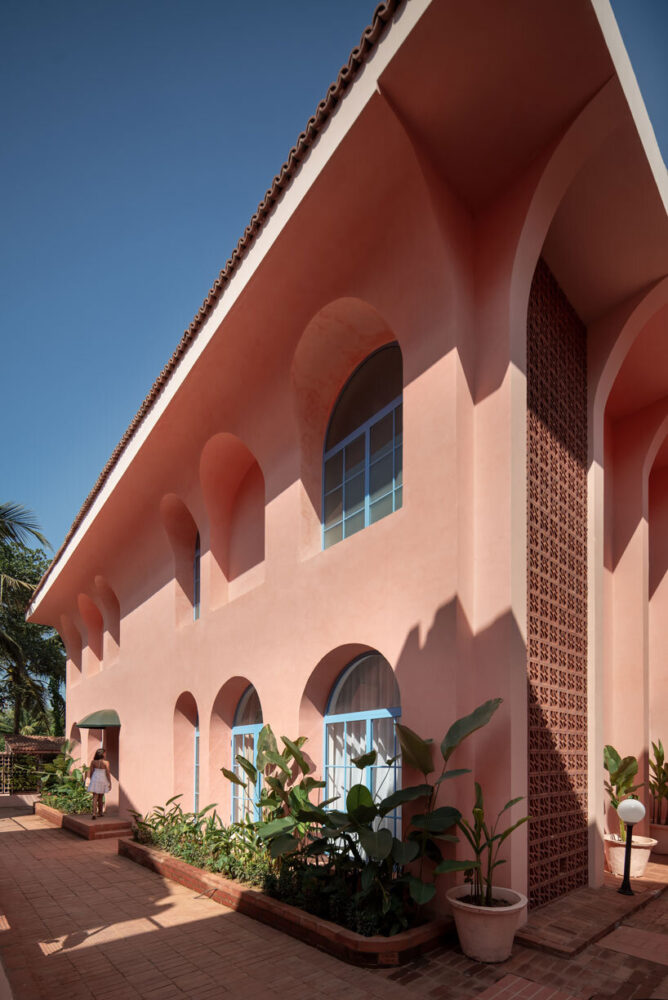six u-shaped villas in north goa shape up bold pink arches around pool ...