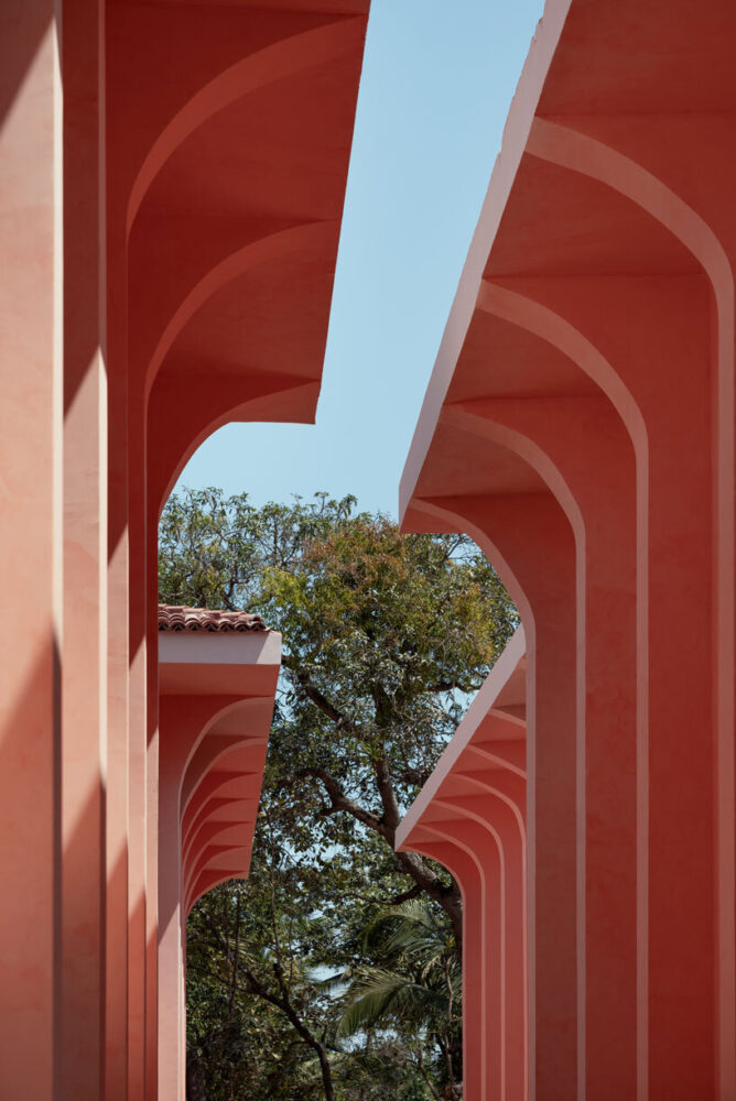 six u-shaped villas in north goa shape up bold pink arches around pool ...