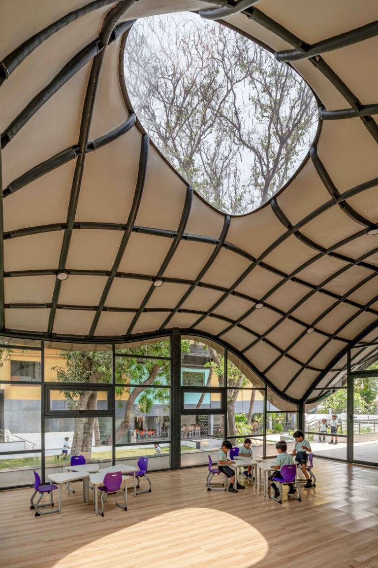 undulating green roof conceals cocoon pre-primary school in india