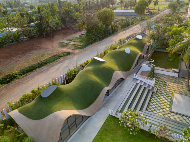 undulating green roof conceals cocoon pre-primary school in india