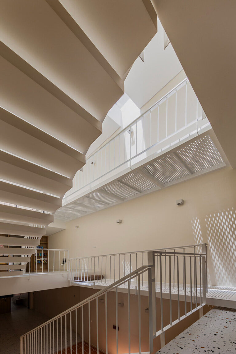 cutouts in slanted concrete roof illuminate vietnamese residence by DMA ...