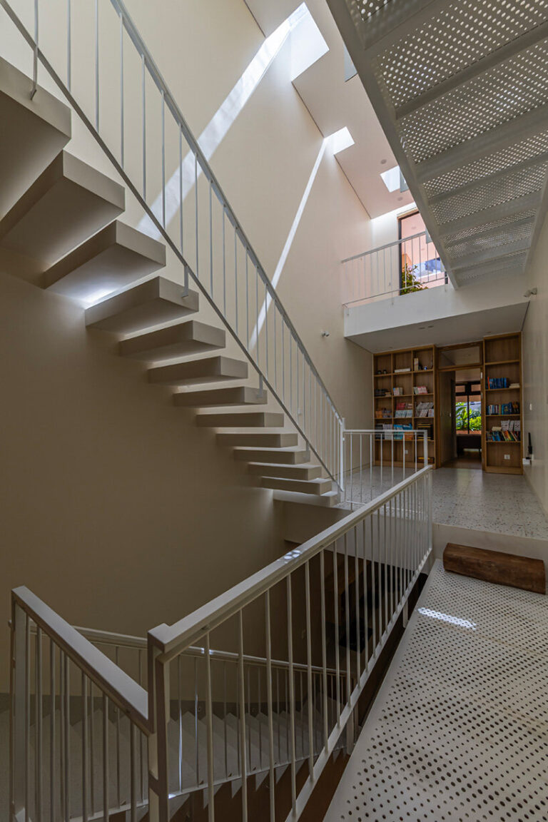 cutouts in slanted concrete roof illuminate vietnamese residence by DMA ...