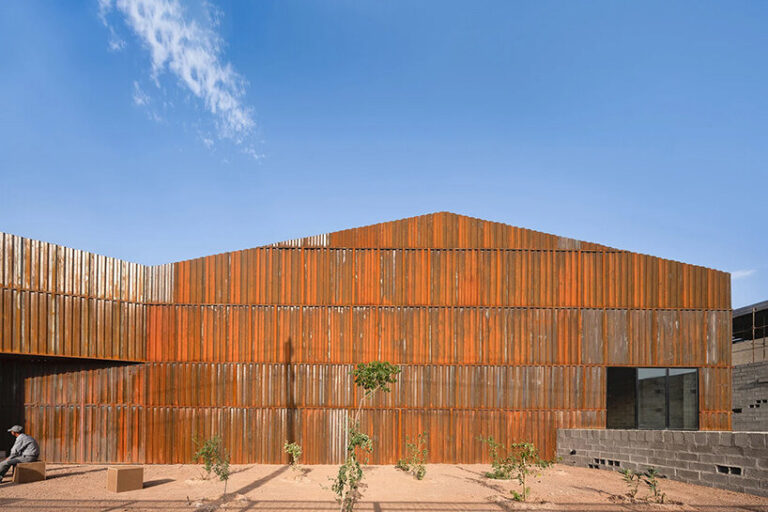 davood boroojeni clads iranian factory building in raw iron sheets