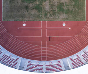 geometric facade wraps stadium by WTA design studio, reflecting ...