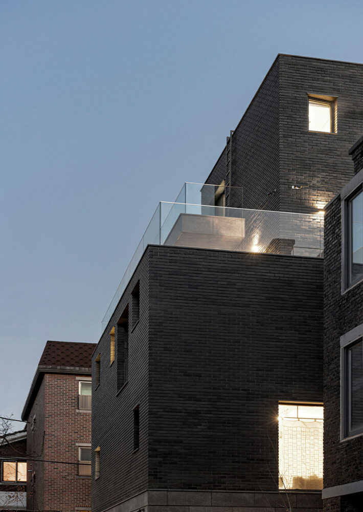 gray brickwork envelops curved 'S gallery' residence near seoul forest