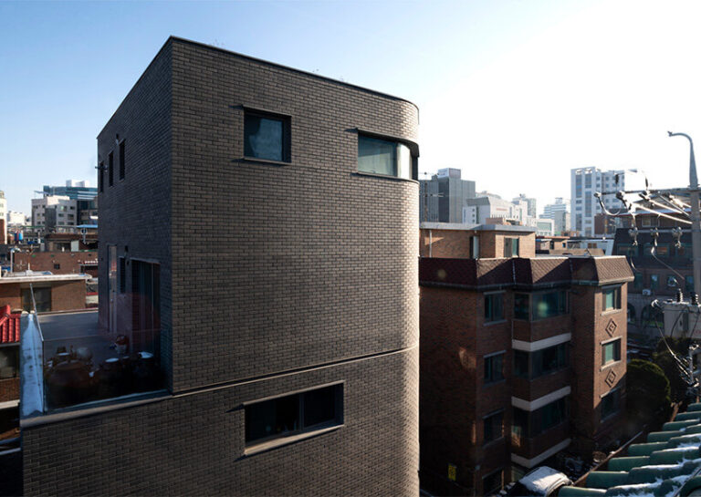 gray brickwork envelops curved 'S gallery' residence near seoul forest