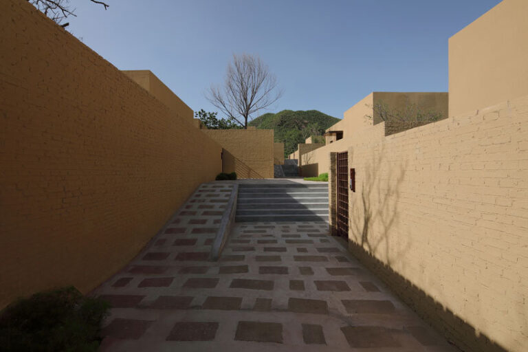 geometric house sculptures emerge from earth for CPLUS' village renewal project in china