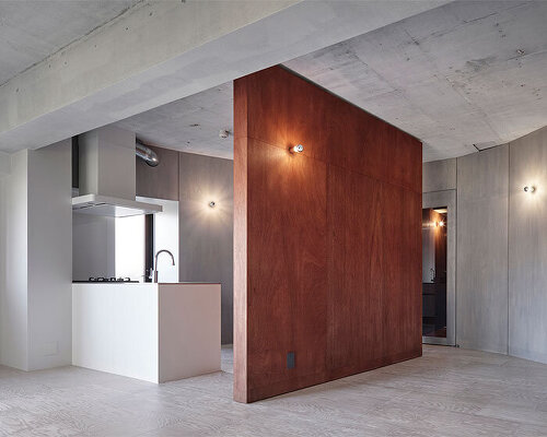 white convex walls dominate the interior of a futuristic apartment by ...