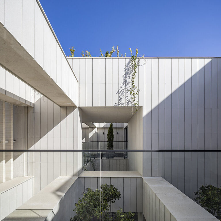 perforated brick facade by mohat office brings texture to iran's ...