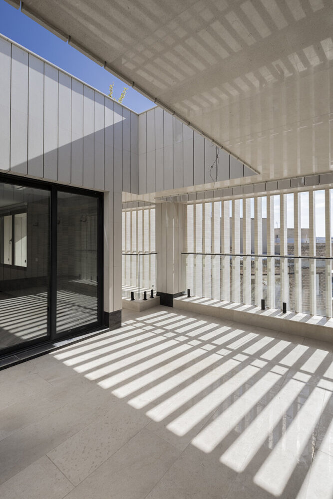 perforated brick facade by mohat office brings texture to iran's ...