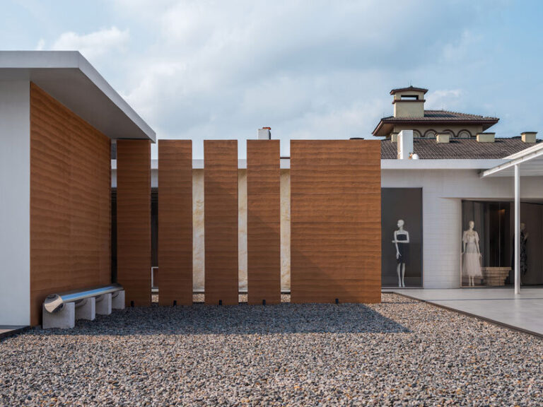 cylindrical columns and stone steps outline resoul rooftop concept store