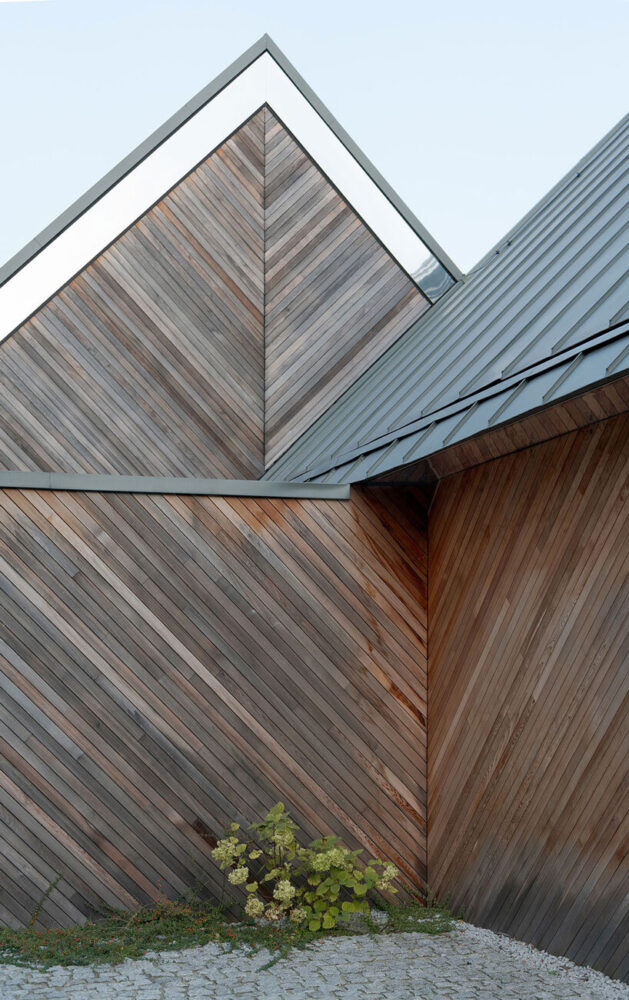 triple house by superhelix unfolds three gabled units clad in red cedar