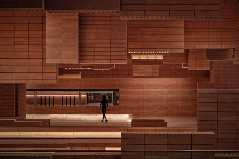 sea of undulating bricks floods chinese cinema café interiors by one ...