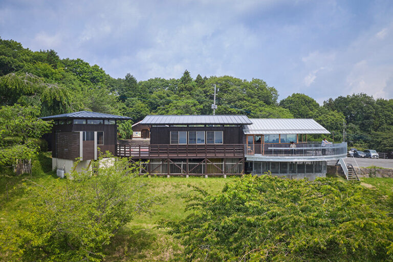 semi-circular terraces look over japanese forest park in renovation by ...