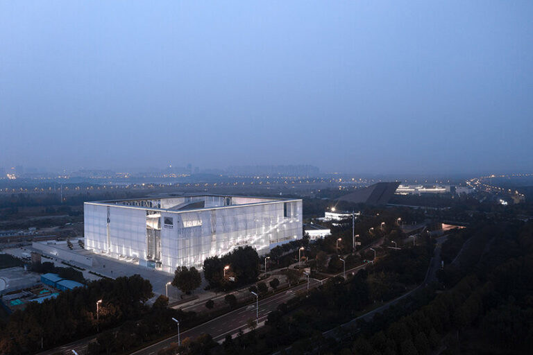 anhui art museum glows behind ethereal facade in hefei, china