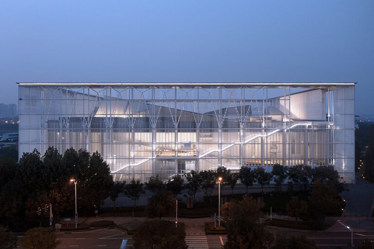 anhui art museum glows behind ethereal facade in hefei, china