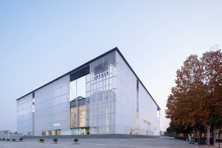 anhui art museum glows behind ethereal facade in hefei, china