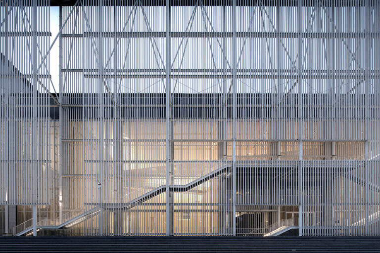 anhui art museum glows behind ethereal facade in hefei, china