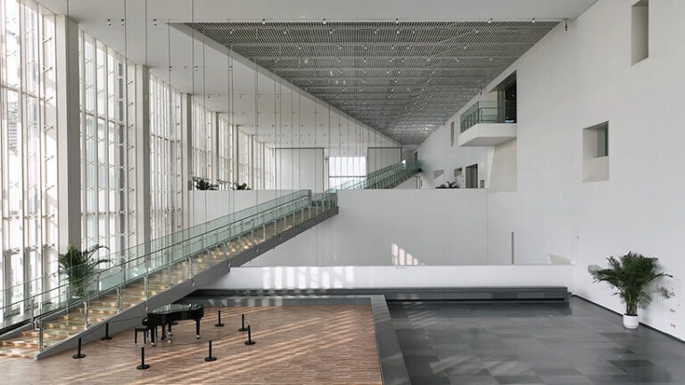 anhui art museum glows behind ethereal facade in hefei, china