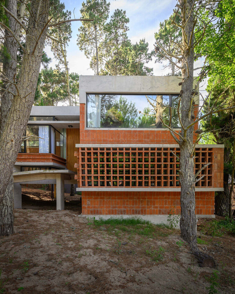 exposed concrete and brick residence adopts 1970s chalet typology in ...