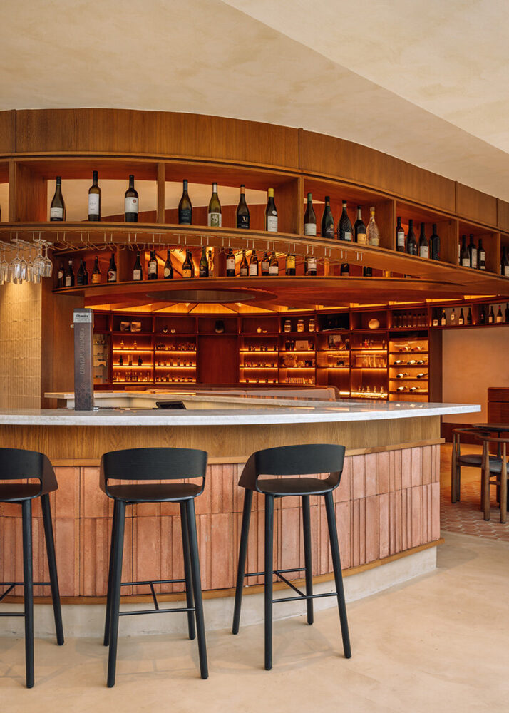 burgundy hues reflect spanish winemaking heritage in hotel by astet studio