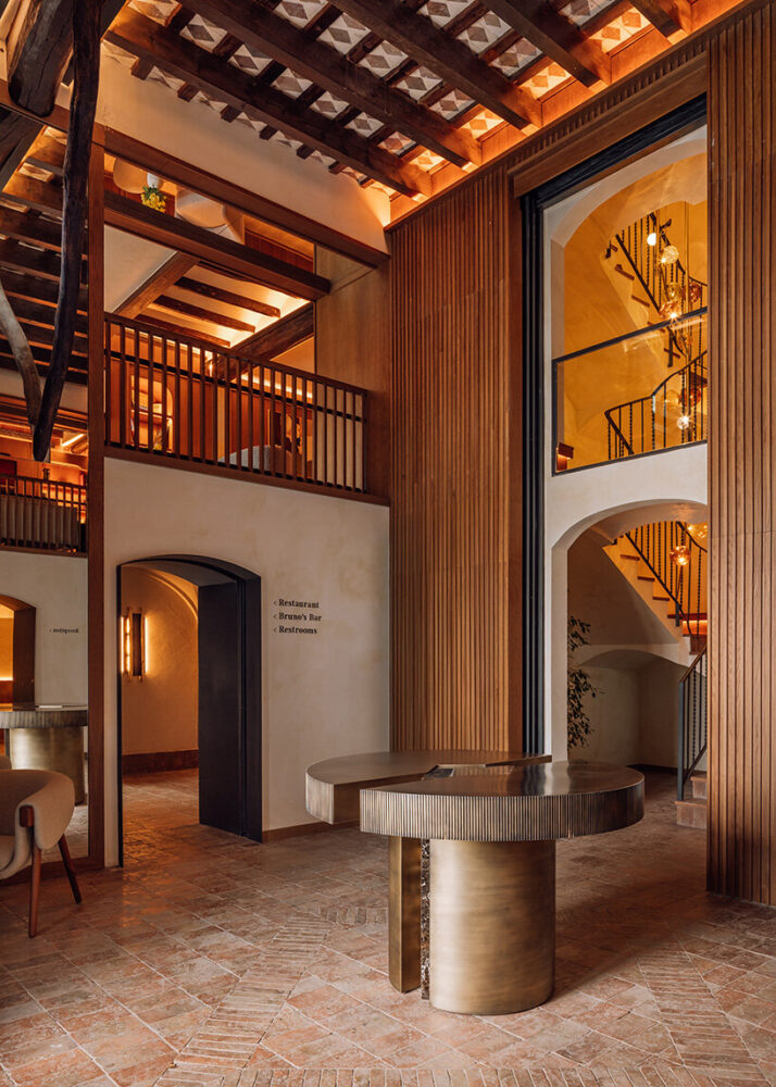 burgundy hues reflect spanish winemaking heritage in hotel by astet studio