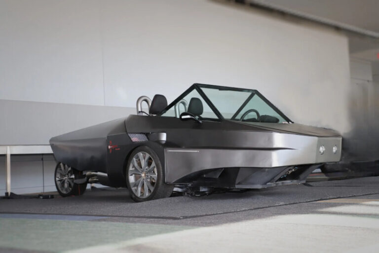 dragonfly three wheeler drives as half-motorcycle, half-steel car