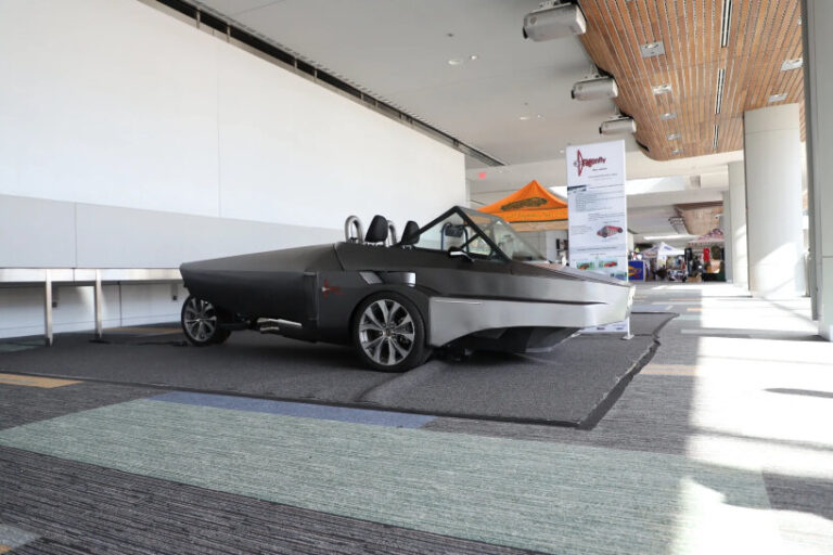 dragonfly three wheeler drives as half-motorcycle, half-steel car