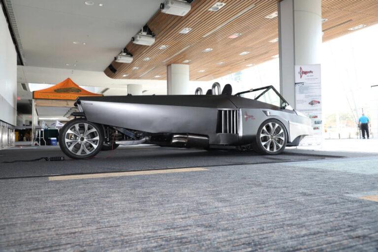 dragonfly three wheeler drives as half-motorcycle, half-steel car