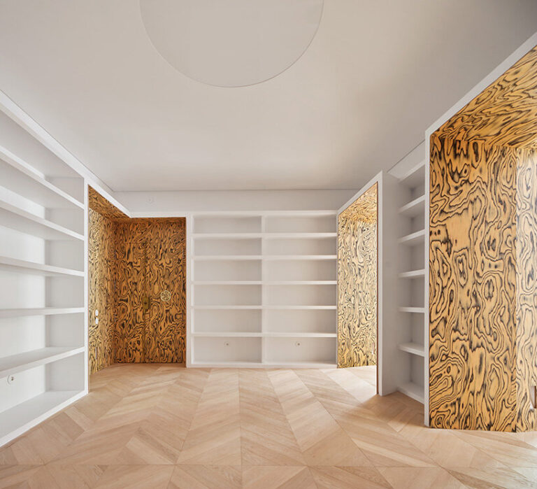 patterned wood and curves frame 18th-century apartment renovation in madrid