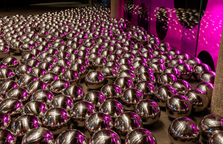 yayoi kusama wraps trees in polka dots ahead of exhibition at NGV