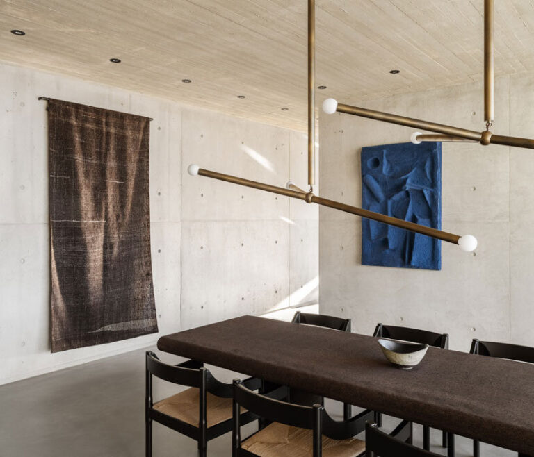 curved dry stone wall outlines mykonian villa by A31 and tom dixon