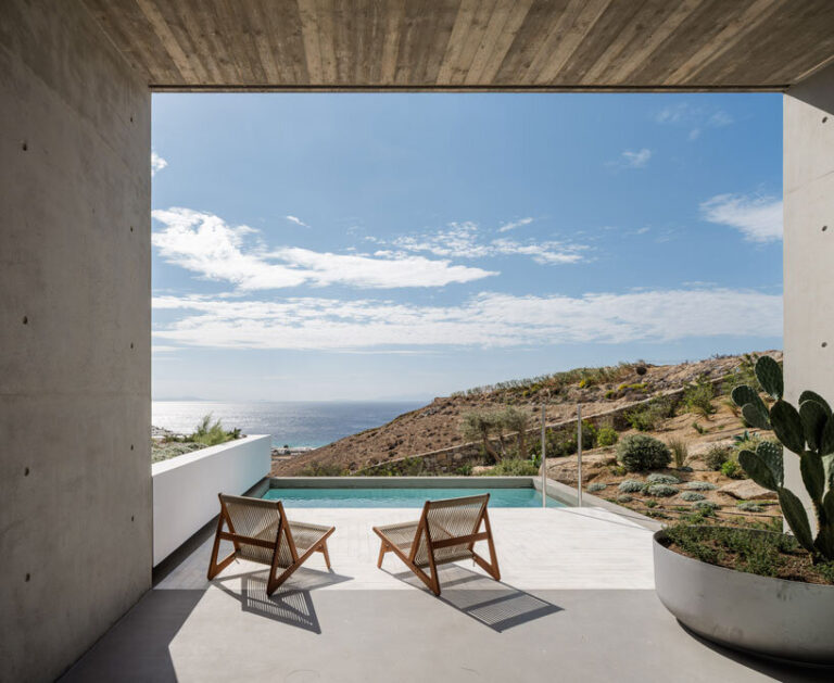 curved dry stone wall outlines mykonian villa by A31 and tom dixon