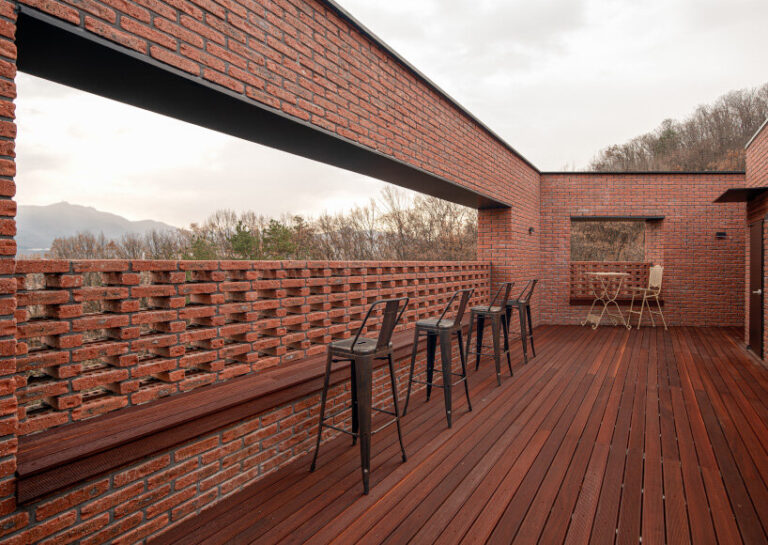 monolithic brick-clad annex by LKSA expands existing residence in ...