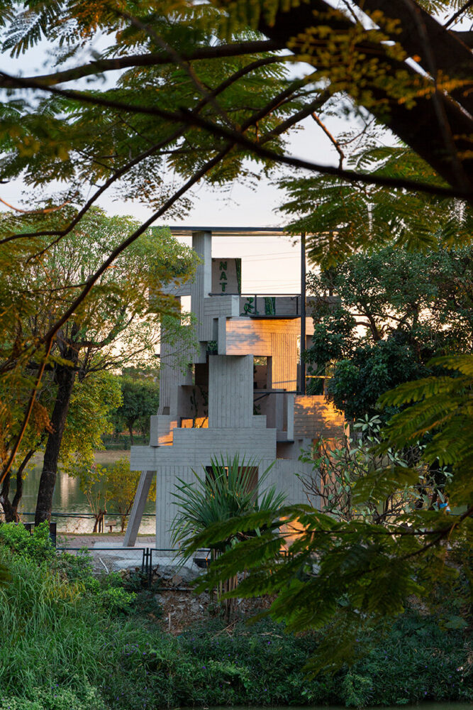 vertical tower by CLAB architects rises from concrete walls in china