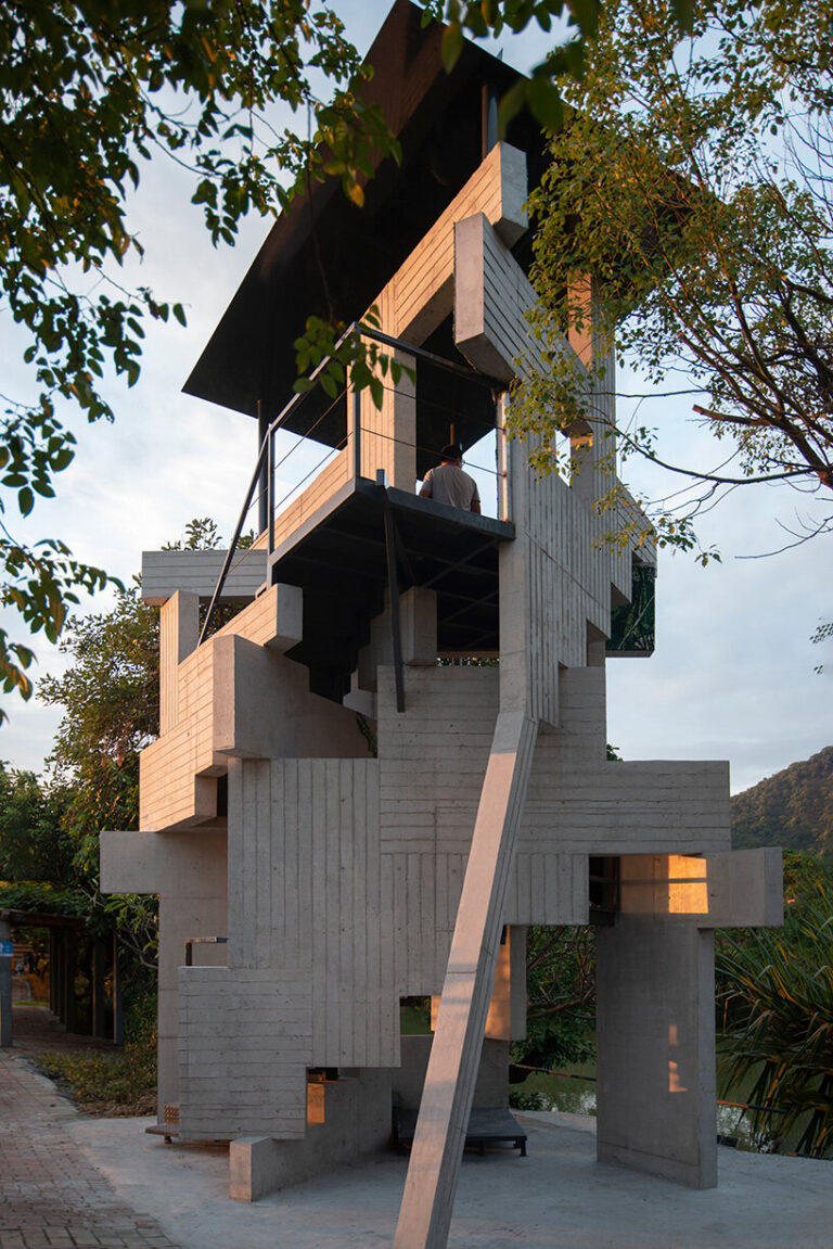 vertical tower by CLAB architects rises from concrete walls in china