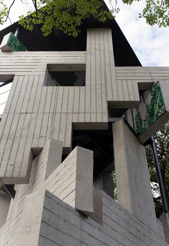 vertical tower by CLAB architects rises from concrete walls in china